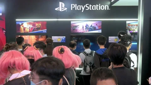 Visitors are seen at the booth from the ... | Stock Video | Pond5