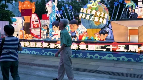 Visitors pose for a photo in front of a ... | Stock Video | Pond5