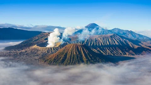 Volcano and Misty Floating Around Hillsi... | Stock Video | Pond5