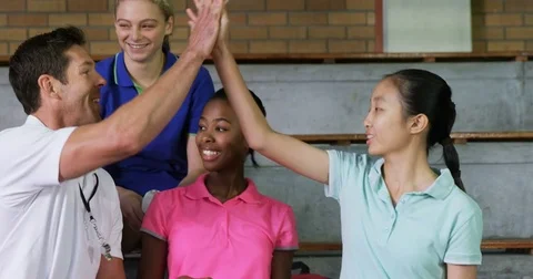 Volleyball coach giving high five to fem... | Stock Video | Pond5
