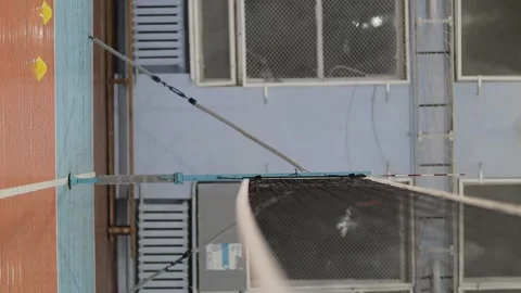 A volleyball net is hanging in a large g... | Stock Video | Pond5