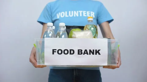 Volunteer holding food bank container, h... | Stock Video | Pond5