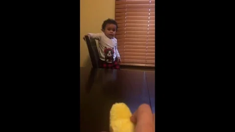 VV3087 Little girl scared of baby chick | Stock Video | Pond5