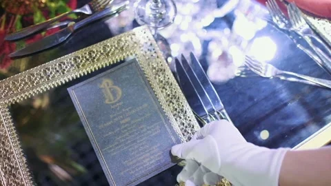 Waiter serves menu and utensils wrapped ... | Stock Video | Pond5