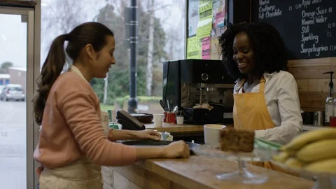 Waitress carrying coffee for bike repair... | Stock Video | Pond5