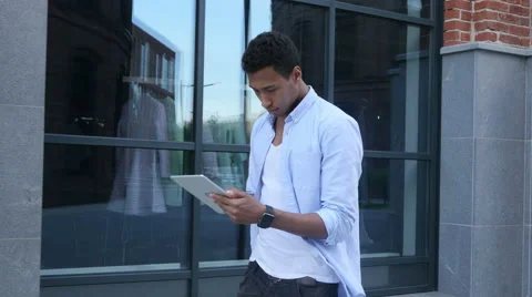 Black Man Using Ipad Stock Footage ~ Royalty Free Stock Videos | Pond5