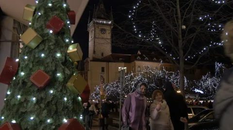 Walking by a Christmas tree with present... | Stock Video | Pond5