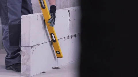 a wall construction by builder | Stock Video | Pond5