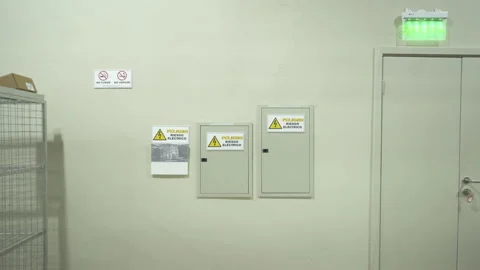 Wall with electrical panel and warning s... | Stock Video | Pond5