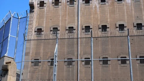 wall of the prison building with small w... | Stock Video | Pond5
