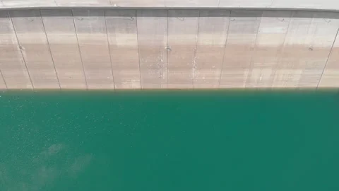 Wall of river dam in mountains. Lake and... | Stock Video | Pond5