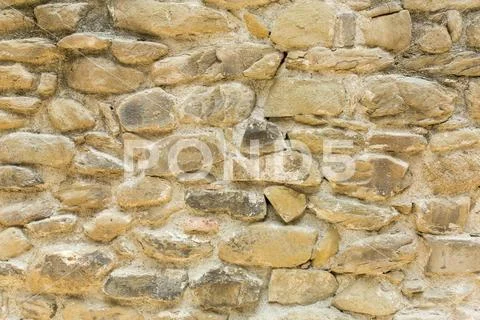 Photograph: Wall of stone View of a detail of an ancient wall Copyright ...