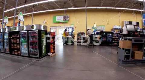 Walmart retail grocery store interior self checkout and people ...