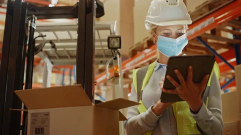Warehouse Female Worker wearing Face Mas... | Stock Video | Pond5