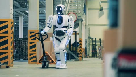 Warehouse robot pulling a cart loaded wi... | Stock Video | Pond5