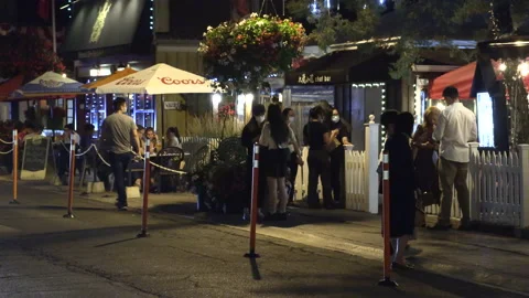 Warm ummer night with people walking and... | Stock Video | Pond5