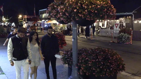 Warm ummer night with people walking and... | Stock Video | Pond5