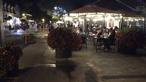 Warm ummer night with people walking and... | Stock Video | Pond5