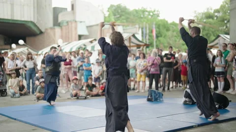 Warmup with sword swinging and jumping f... | Stock Video | Pond5