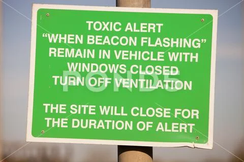 A warning sign about toxic air pollution outside a power from waste ...