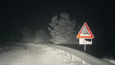 Warning sign for danger on road winter s... | Stock Video | Pond5