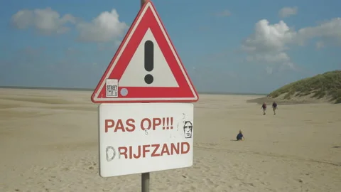 Warning Sign of quick sand on the beach ... | Stock Video | Pond5