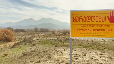 Warning signpost about border line zone ... | Stock Video | Pond5