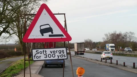 warning of soft verges for vehicle in la... | Stock Video | Pond5