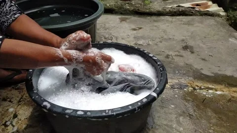 washing clothes by hand and without usin... | Stock Video | Pond5