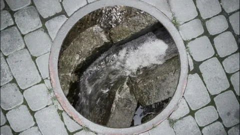 Wastewater flows in drain at the bottom ... | Stock Video | Pond5