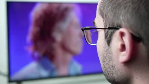 Watching a Live Music Show on TV Screen | Stock Video | Pond5