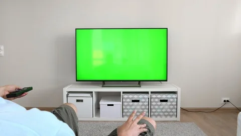 Watching tv with green screen at home in... | Stock Video | Pond5