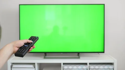 Watching tv with green screen at home in... | Stock Video | Pond5