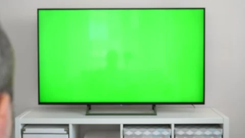 Watching tv with green screen at home in... | Stock Video | Pond5