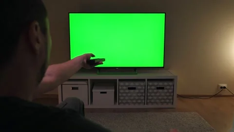 Watching tv with green screen at home | Stock Video | Pond5