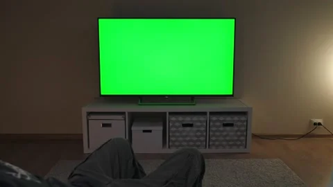 Watching tv with green screen at home | Stock Video | Pond5