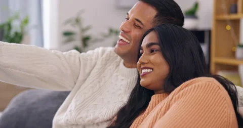 Watching tv, hug and happy couple laughi... | Stock Video | Pond5