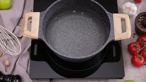 water boiling in a pot on induction hob ... | Stock Video | Pond5