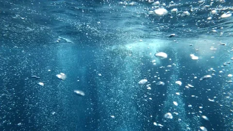 Water bubbles rise to the surface of the... | Stock Video | Pond5