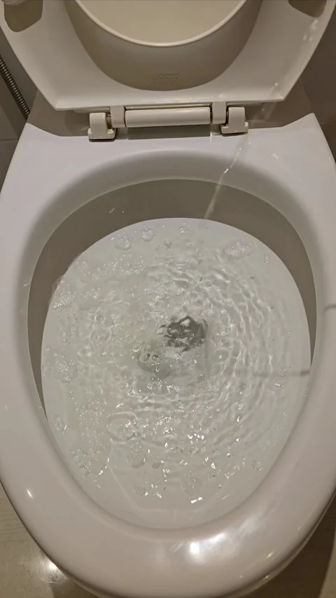 Water cleaning flush toilet in restroom. | Stock Video | Pond5