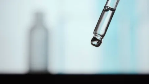 Water drop falling from Liquid dropper o... | Stock Video | Pond5