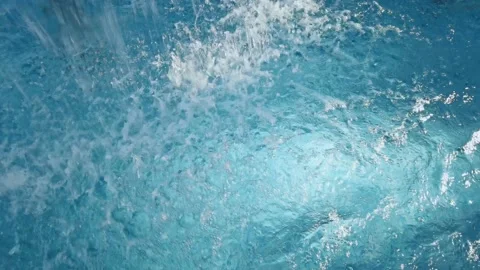 Water drop in swimming pool. Blue color.... | Stock Video | Pond5