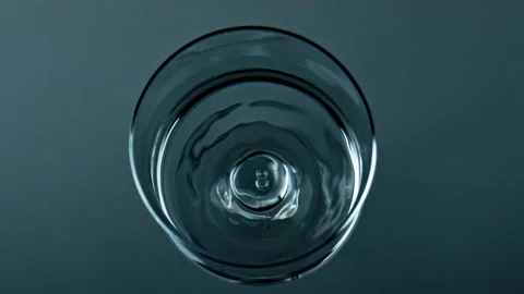 Water droplet falling cup top view. Pure... | Stock Video | Pond5