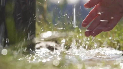 Water droplets fall into puddle with wat... | Stock Video | Pond5