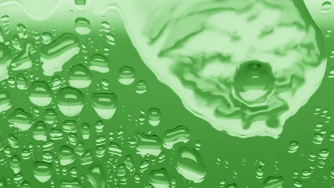 Water drops fall down on big one splashi... | Stock Video | Pond5