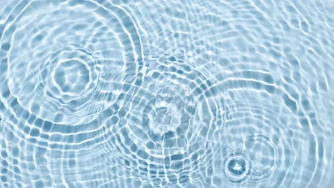 Water drops falling on water surface mak... | Stock Video | Pond5