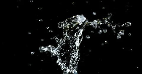 Water Exploding and Splashing against Bl... | Stock Video | Pond5
