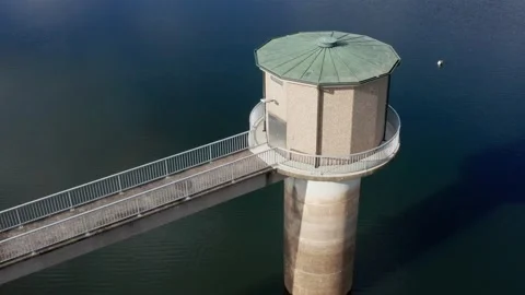 a water extraction tower in a dam flying... | Stock Video | Pond5