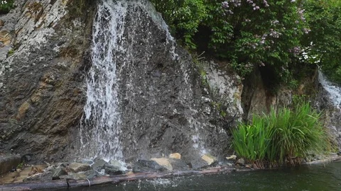 Water falls on stones from hell on rock ... | Stock Video | Pond5