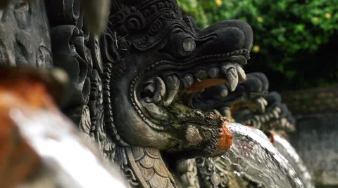 Water flowing from dragon sculpture in h... | Stock Video | Pond5